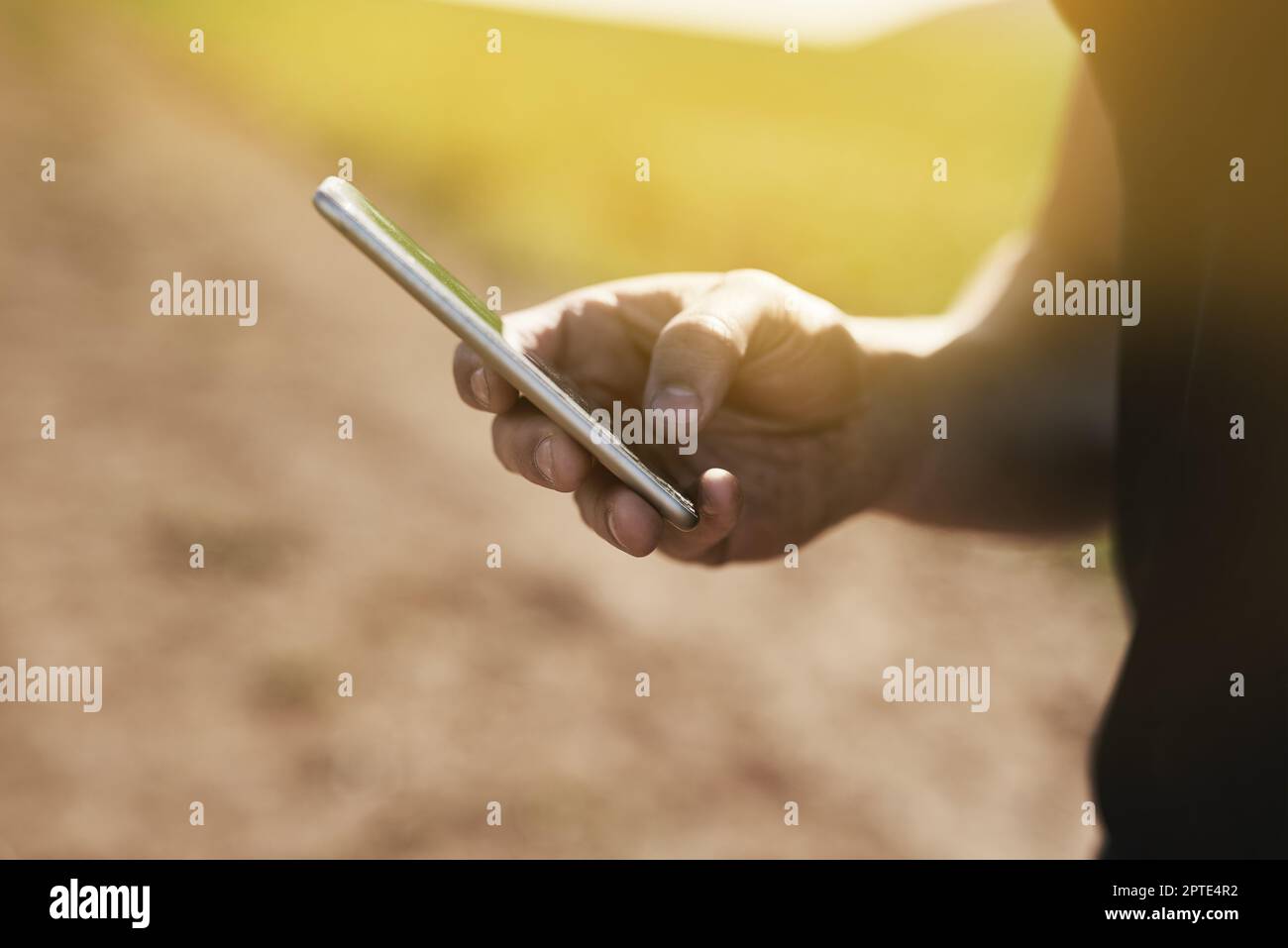 Turning his Location on. an unrecognizable man using his cellphone ...