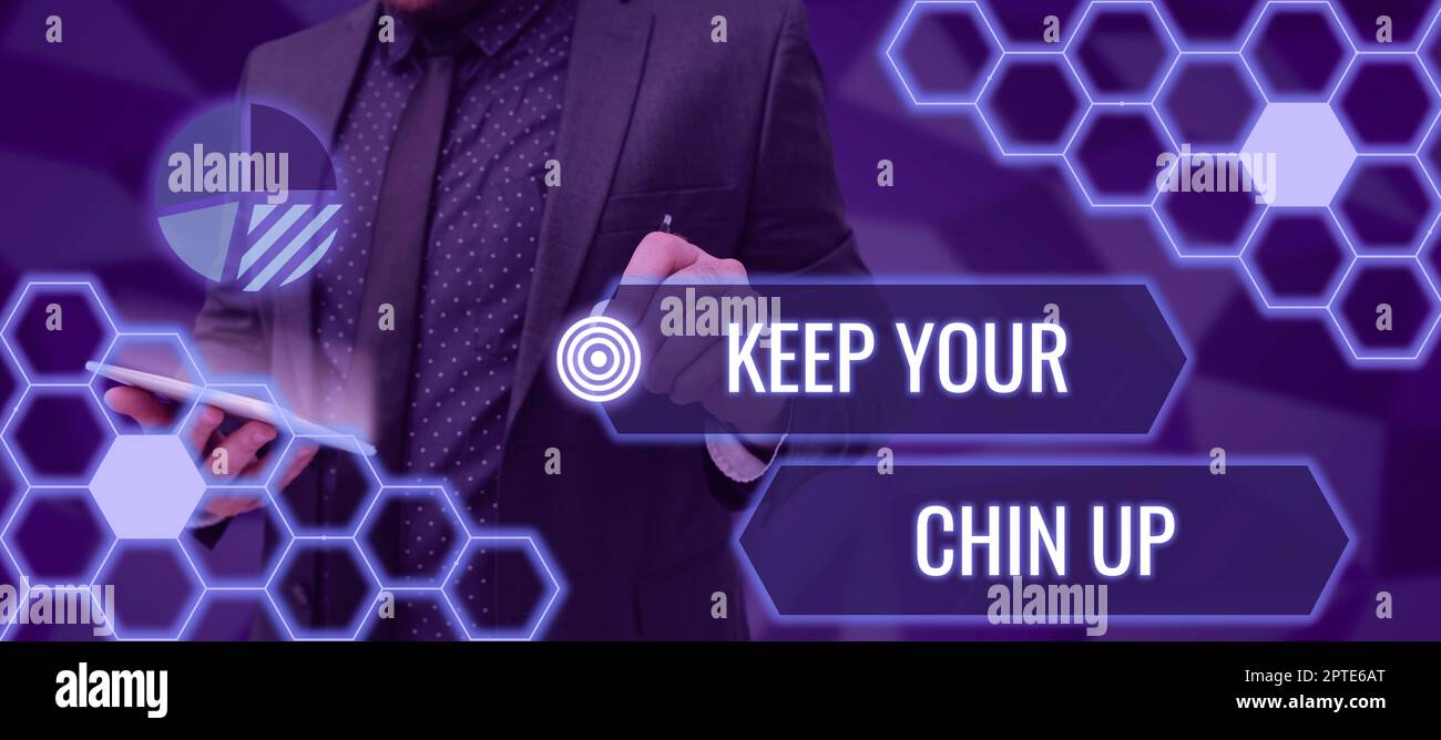 Sign displaying Keep Your Chin UpRemain cheerful in difficult ...