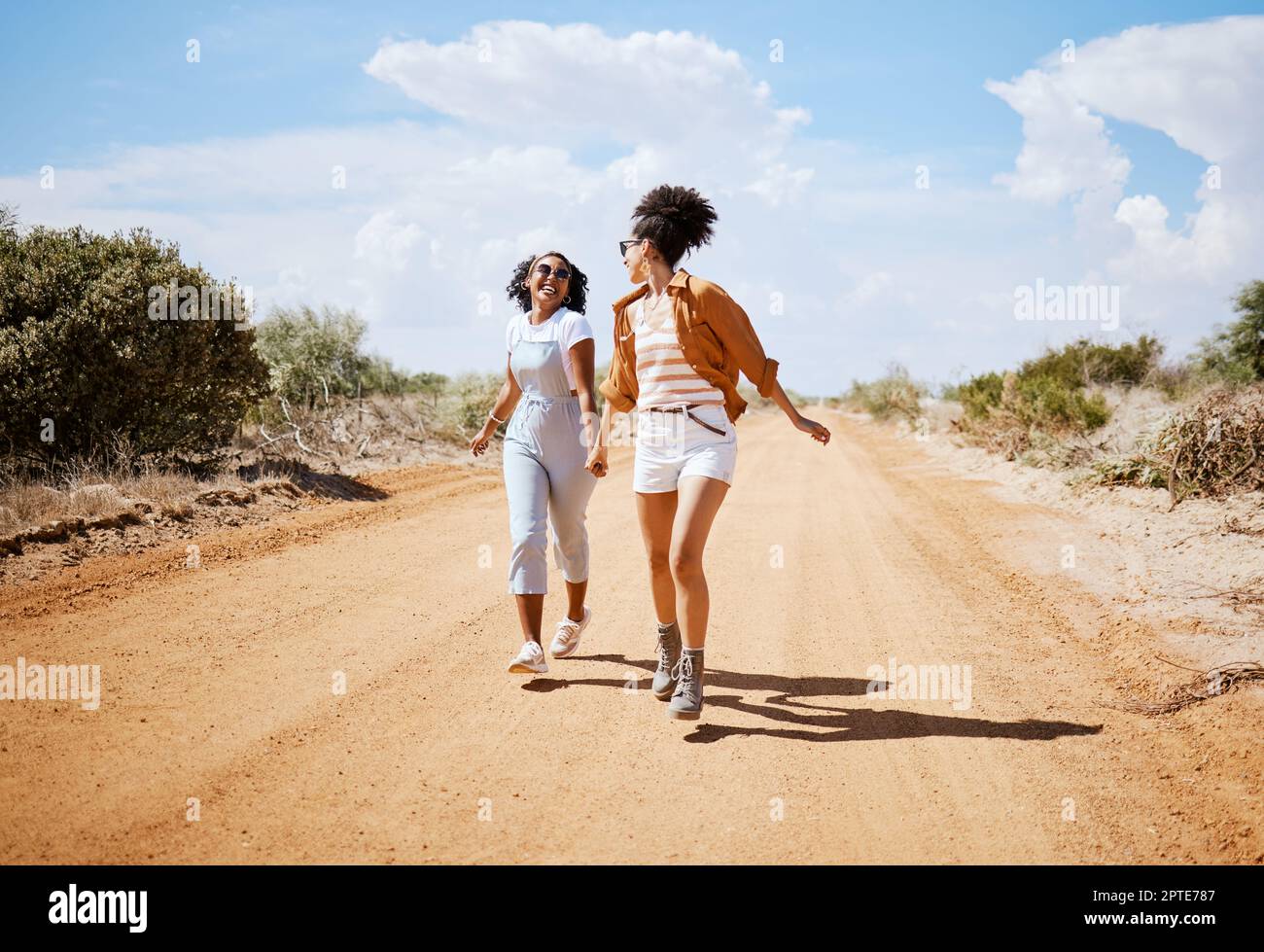Energy, friends and travel with women walking on a dirt road, explore ...