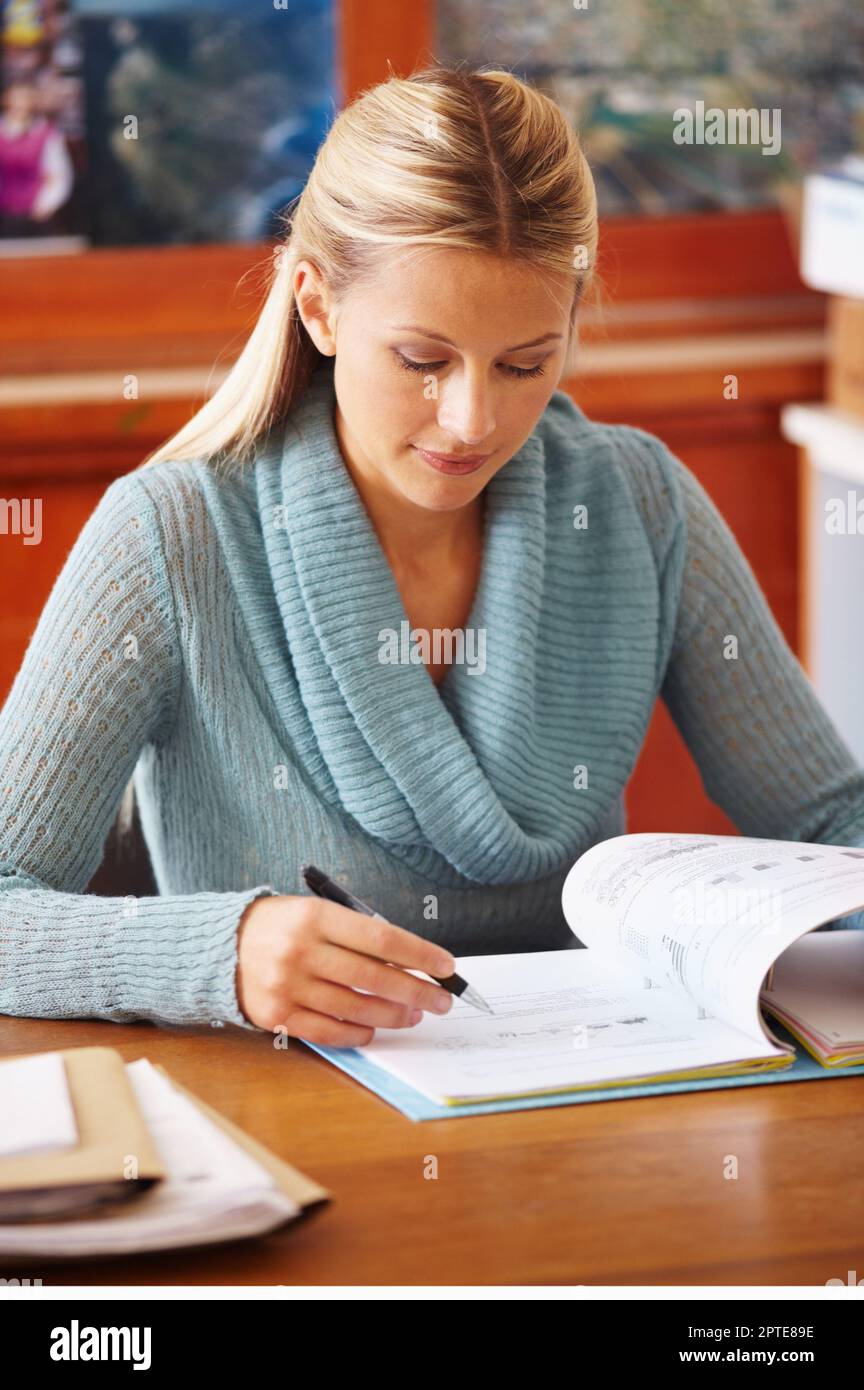 Female teacher marking homework hi-res stock photography and images - Alamy