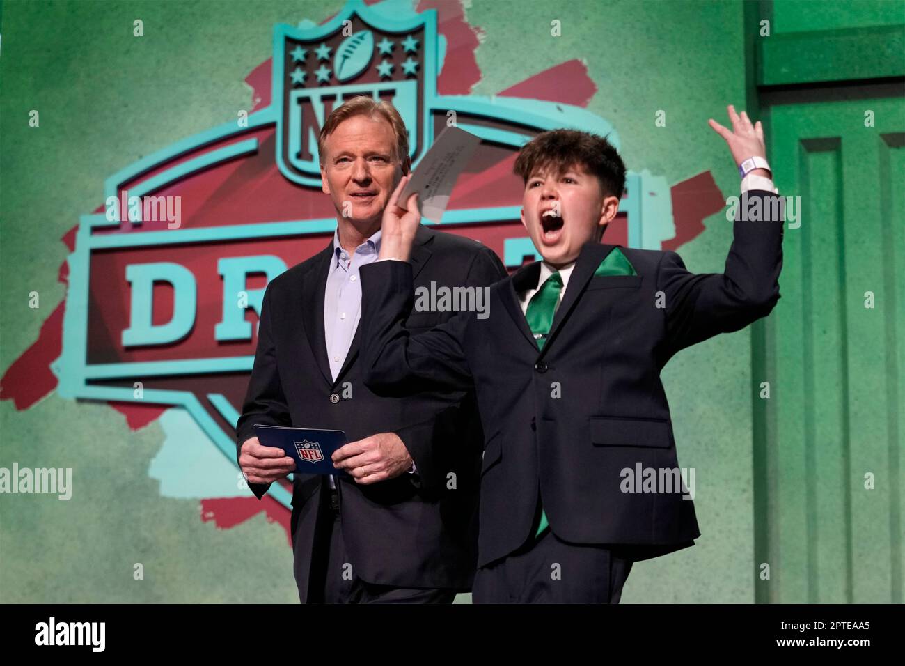 Cancer survivor Kyle Stickles, right, who is a Make-A-Wish kid, walks ...