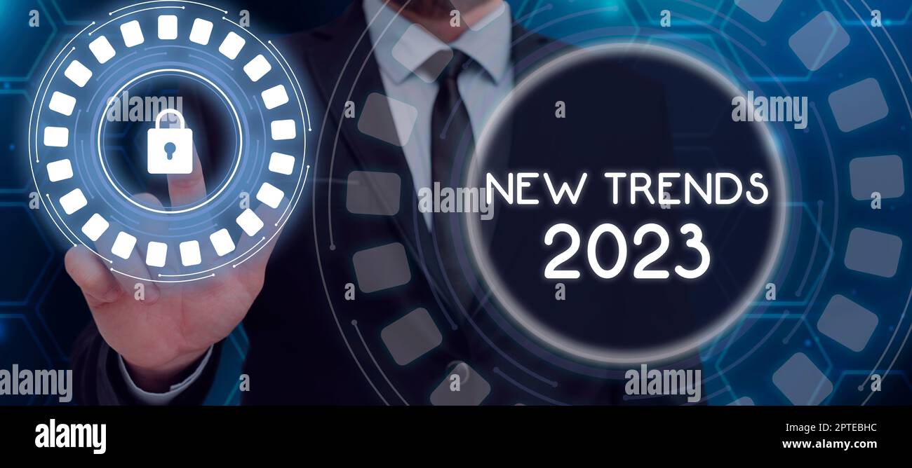 Hand writing sign New Trends 2023, Business overview general direction ...