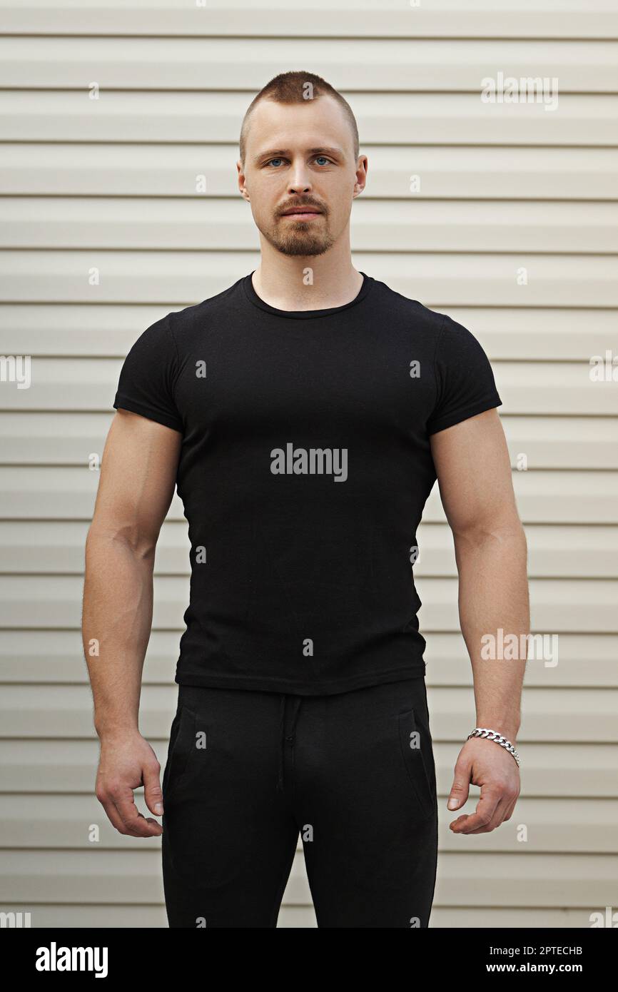 Strong man in black hi-res stock photography and images - Alamy