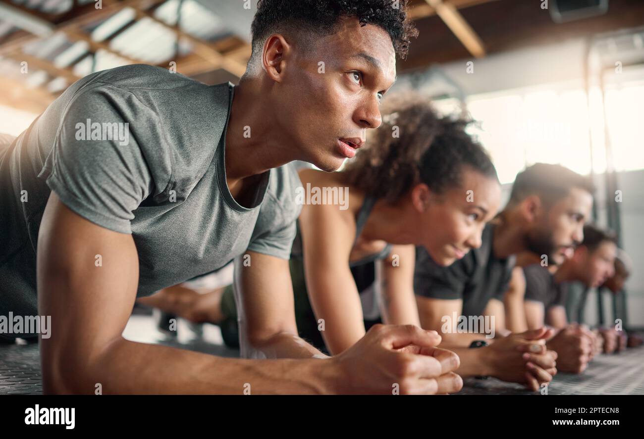 Gym, fitness and plank floor workout, challenge and power exercise by young people, focus and ...
