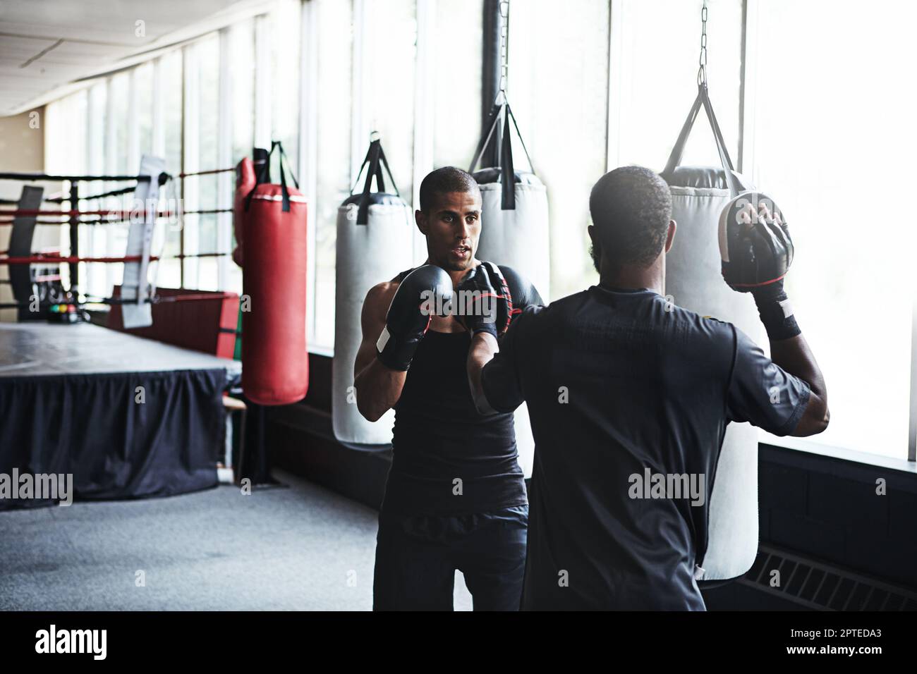 You can crumble or you can conquer. a male boxer practising his moves ...