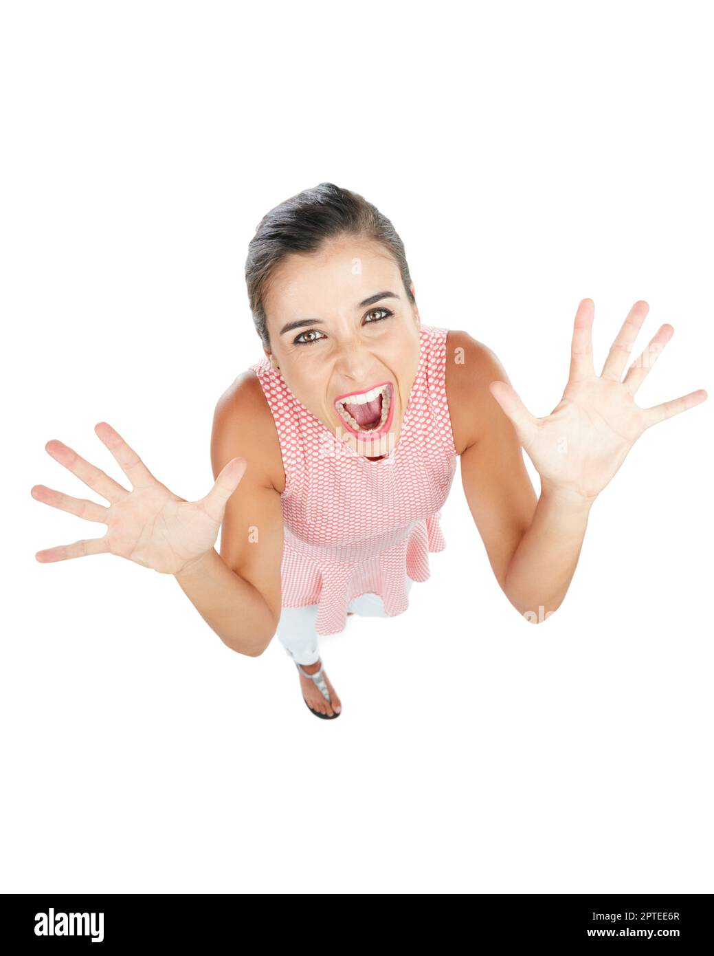I have some awesome news. Studio portrait of a young woman shouting ...