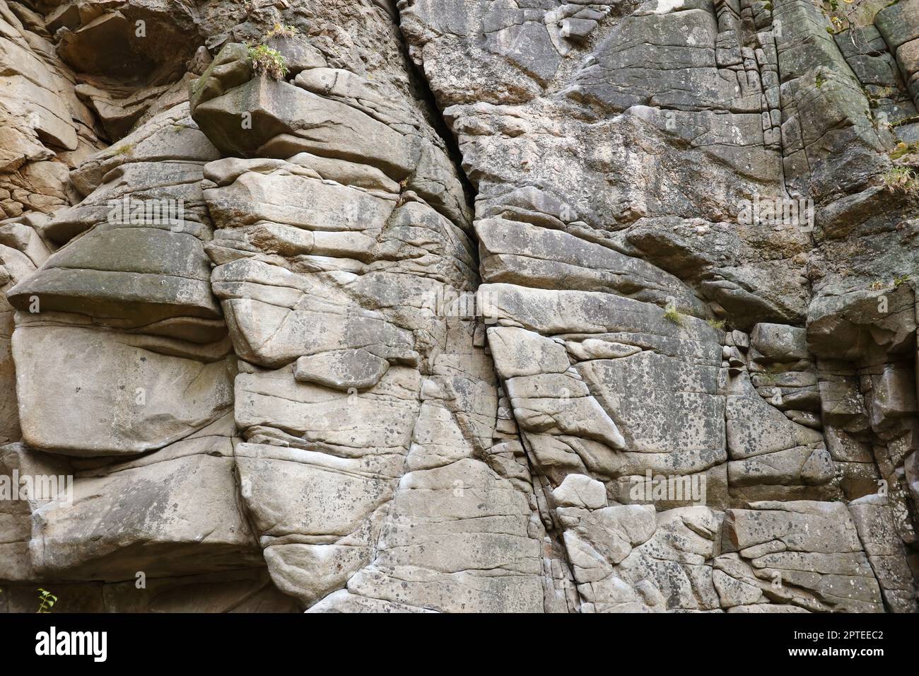 Light coarse natural rock stone background. Mining cliff rough front ...