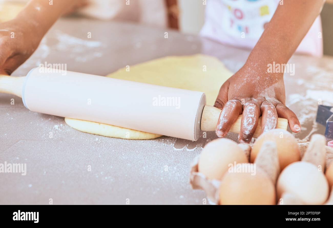 Child, baking and cooking with hands on table with rolling pin for ...