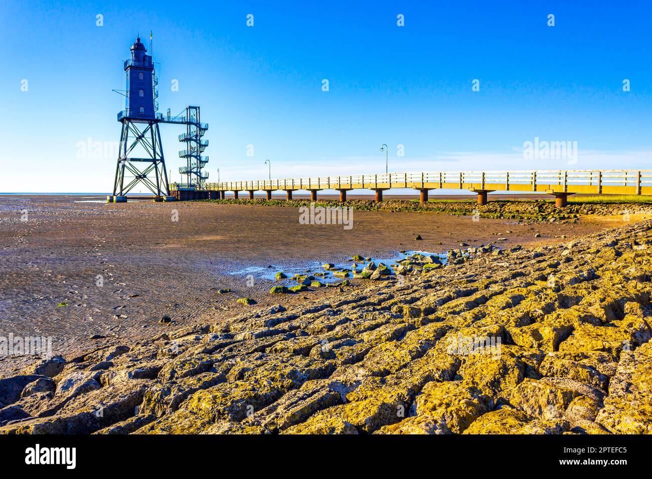 Black lighthouse tower Obererversand in Wadden Sea landscape in Dorum ...