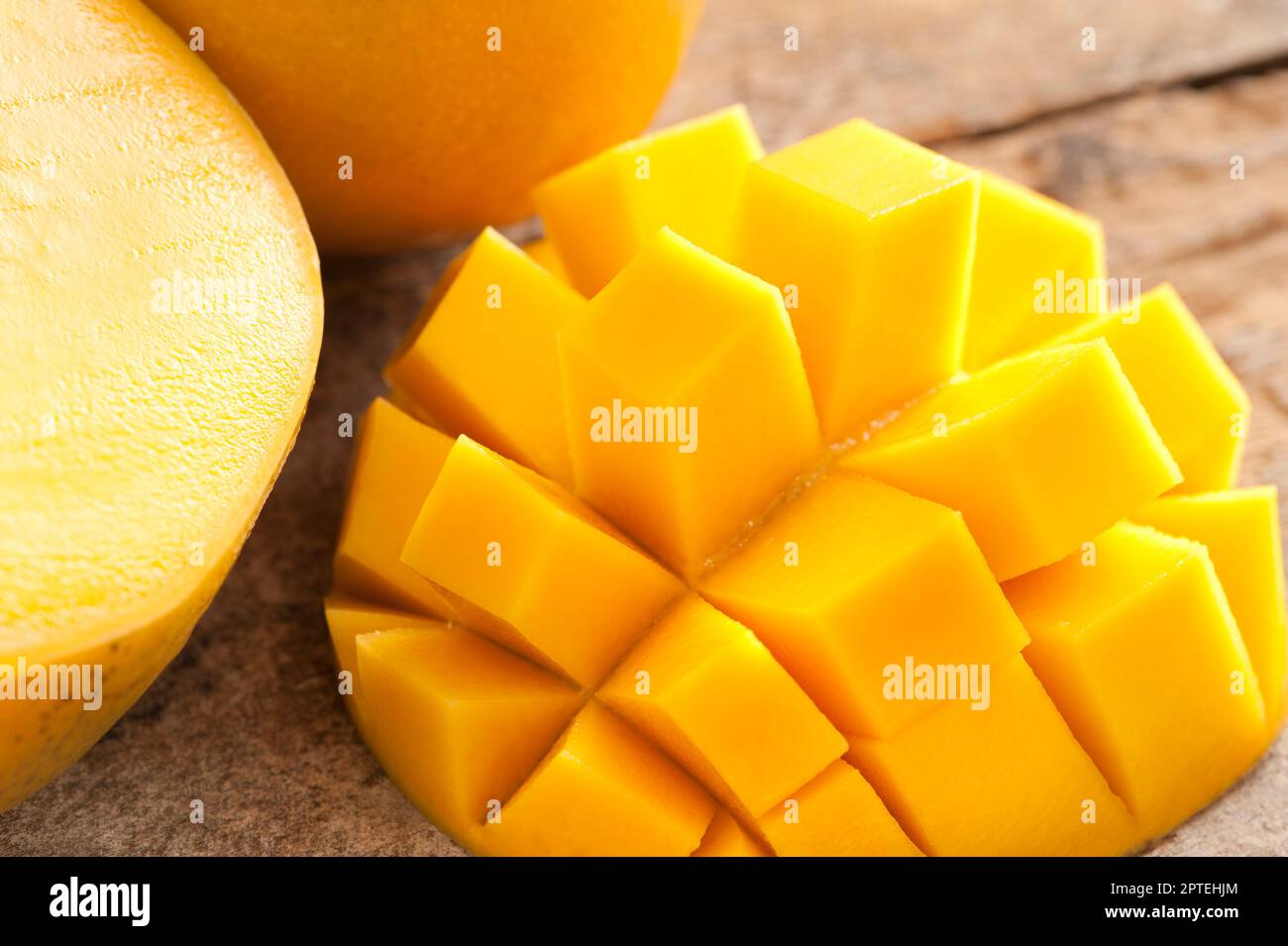 Delicious ripe sweet tropical mango sliced through in a hedgehog ...