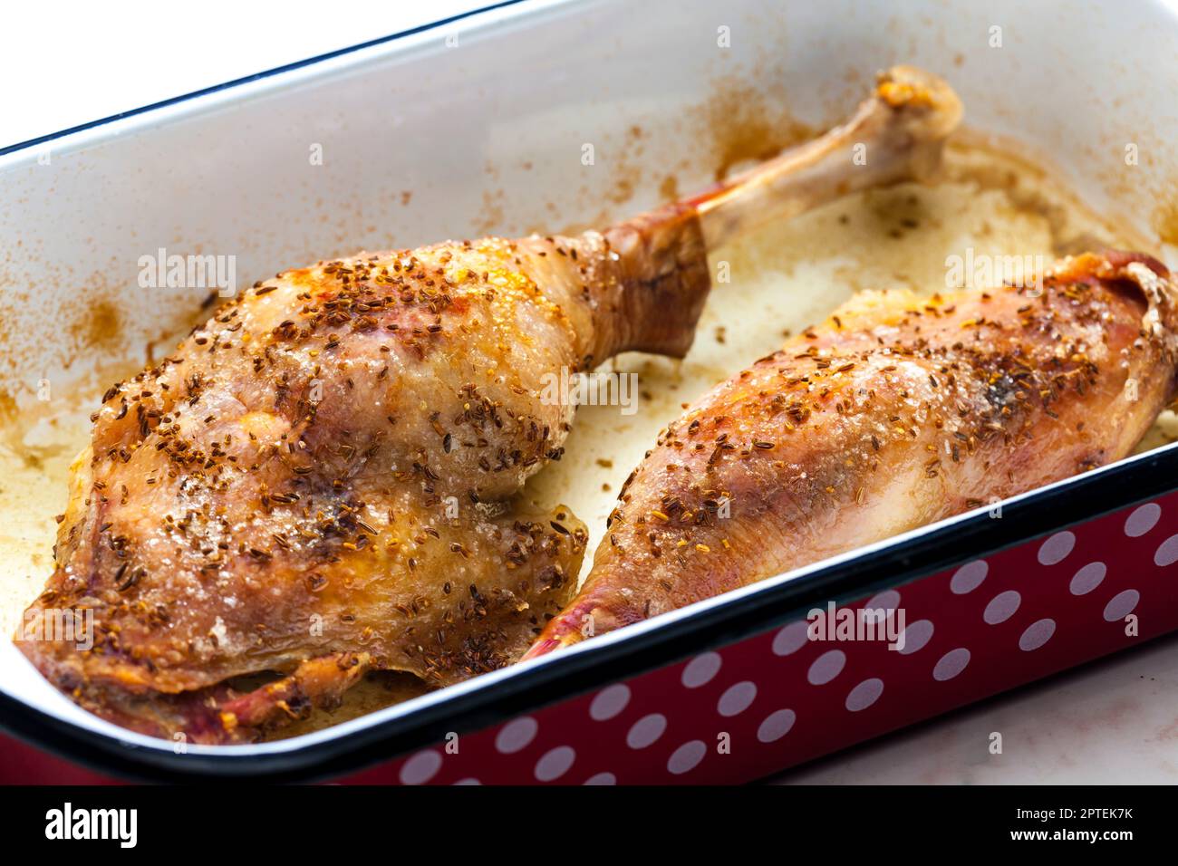 baked goose legs with cumin in frying pan Stock Photo - Alamy
