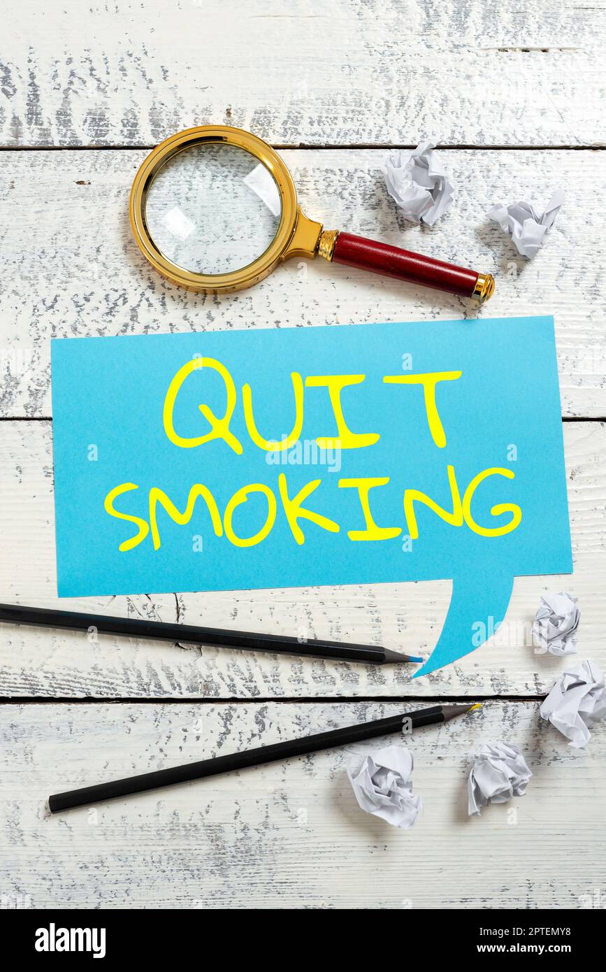 Sign displaying Quit Smoking, Business showcase Discontinuing or ...