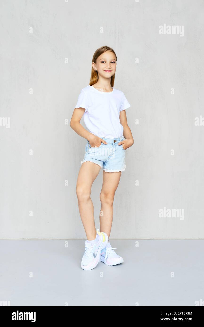 Woman in short shorts white background hi-res stock photography and ...