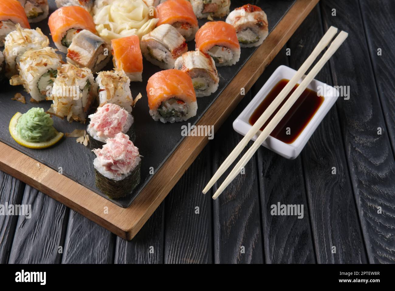 Big set of rolls served on stone plate. Layout for menu Stock Photo - Alamy