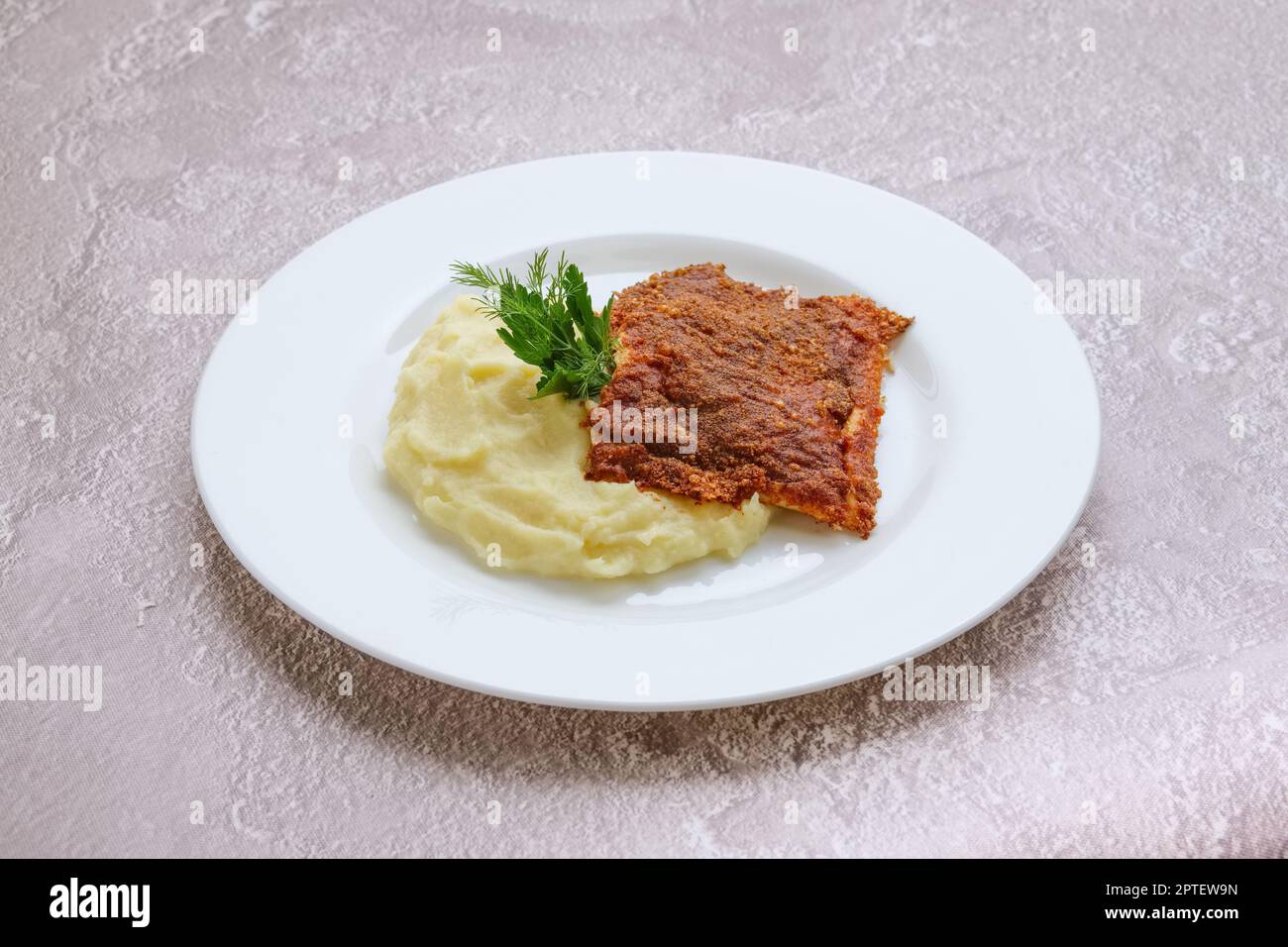 Fried hake fillet with spinach, cheese and rice Stock Photo - Alamy