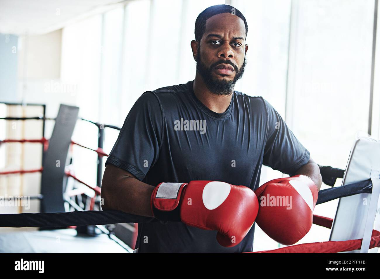 The king of the boxing ring. Portrait of a man training in a boxing ...