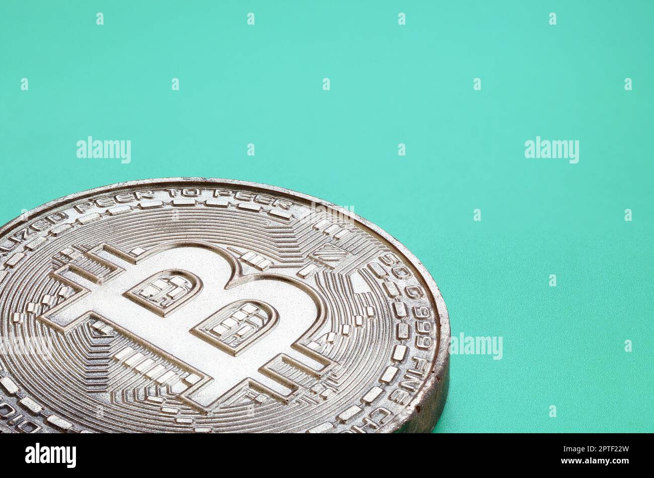 Chocolate product in the form of physical bitcoin lies on a green ...