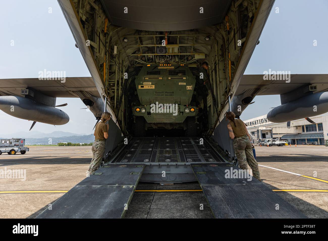 U.S. Airmen, with 1st Special Operations Squadron, observe the loading ...