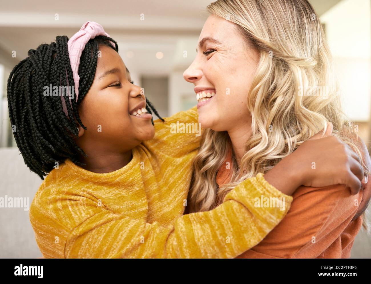Mother, adopted and daughter bonding or hugging with love, care and ...
