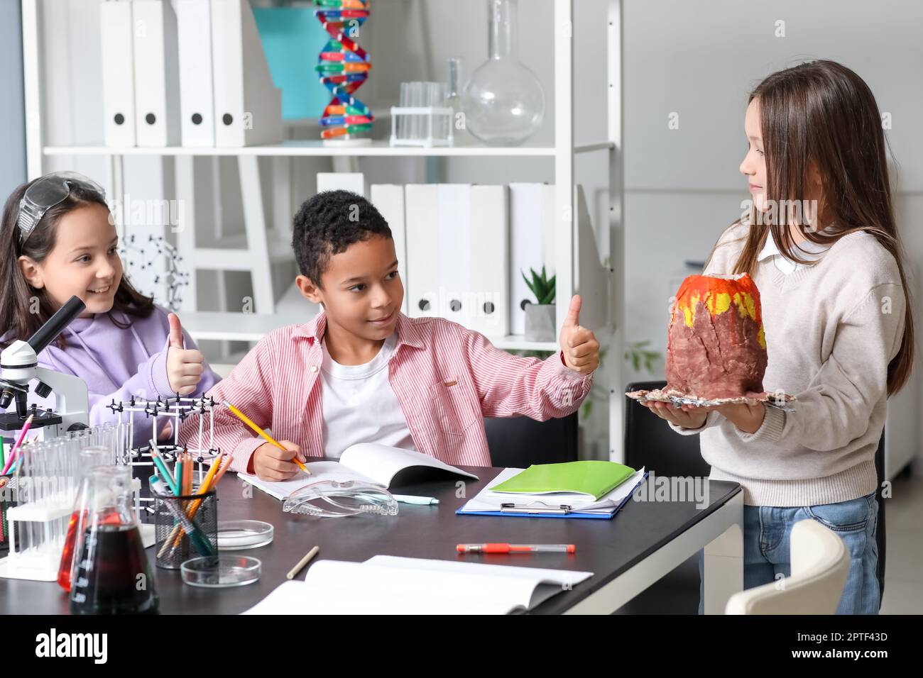 Little children with chemical volcano in science classroom Stock Photo ...