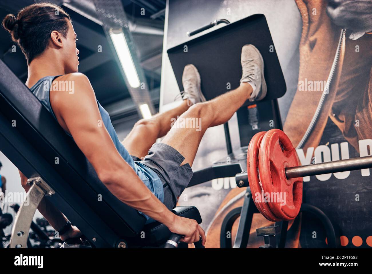 Young male on leg press machine hi-res stock photography and images - Alamy