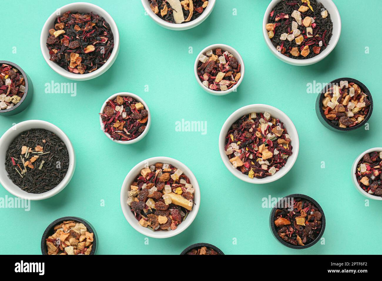 Assortment with different types of dried fruit tea on turquoise ...