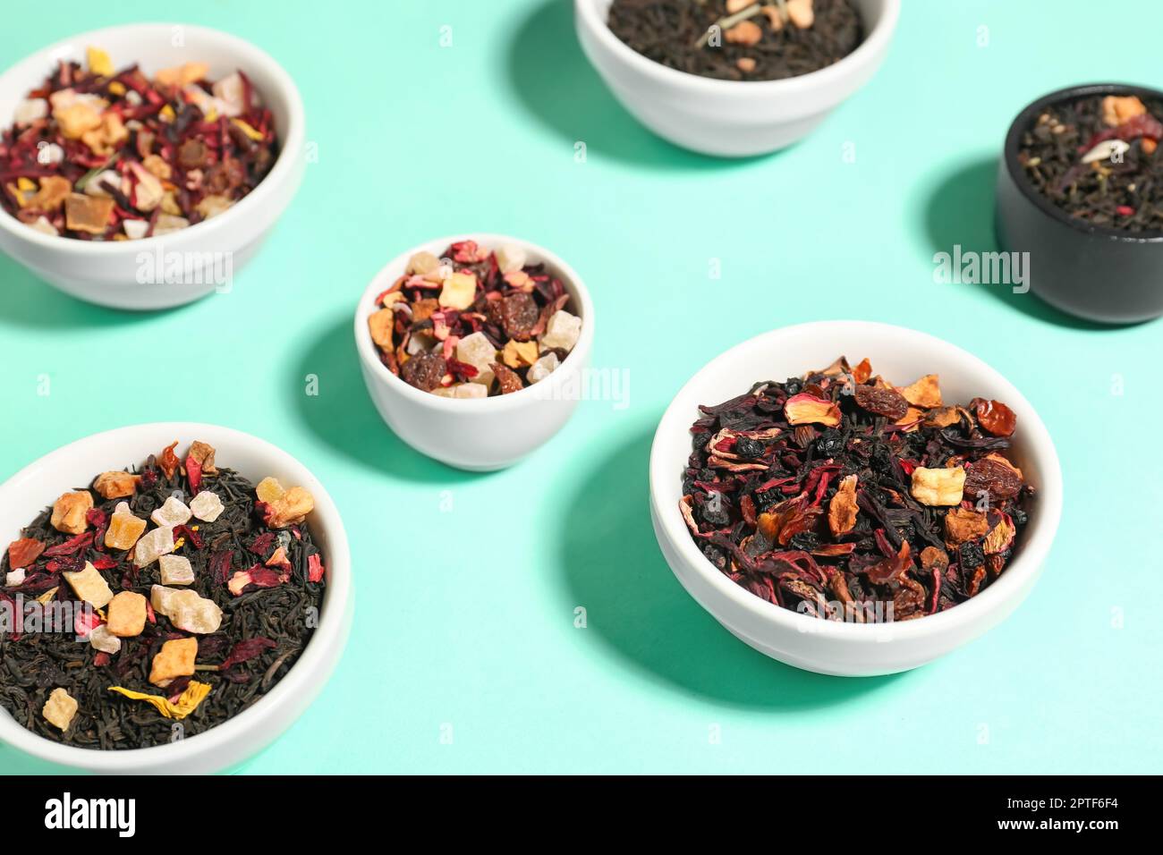 Assortment with different types of dried fruit tea on turquoise ...