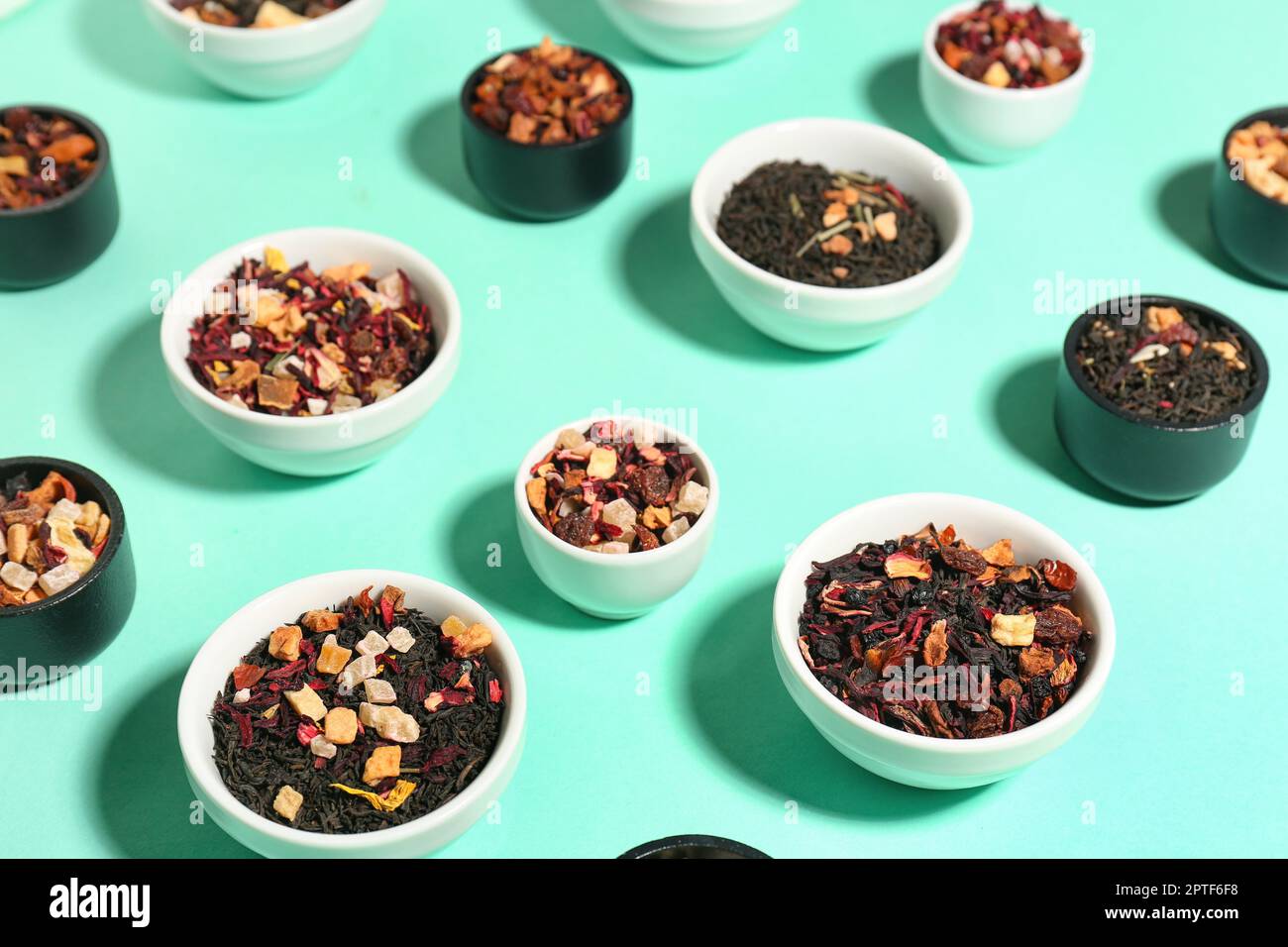 Assortment with different types of dried fruit tea on turquoise ...