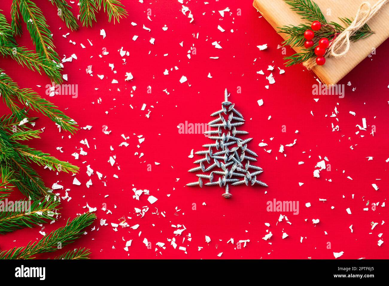 Christmas tree made of self-tapping screws, gift in craft paper with ...