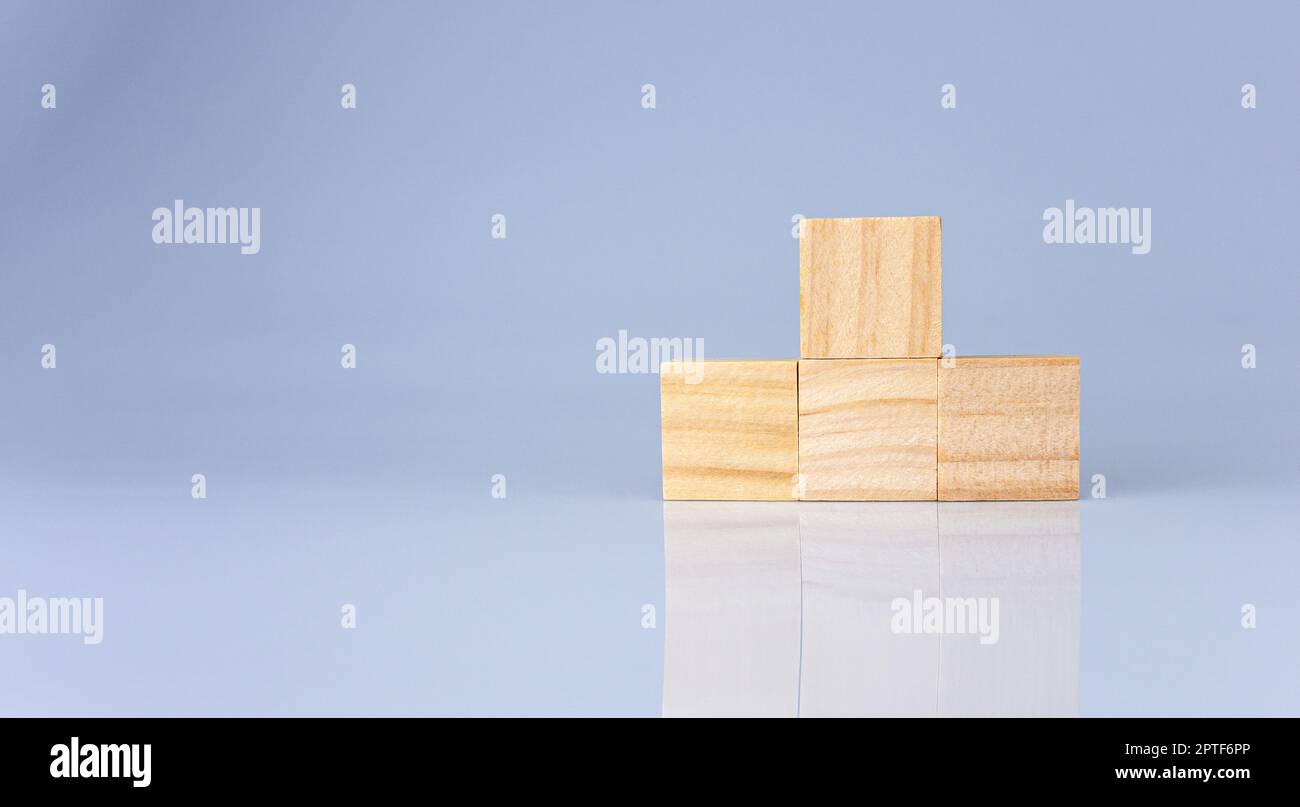 empty wooden blocks lined up on a white background. Business concept ...