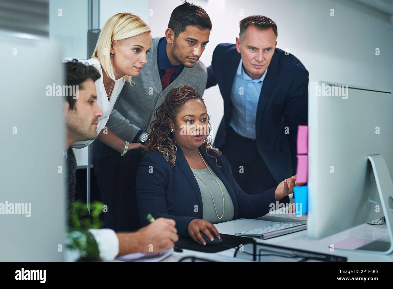 Success is the product of teamwork. corporate colleagues working ...