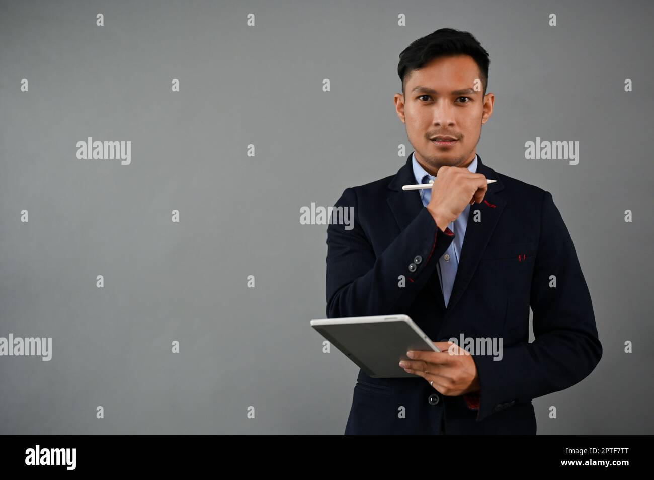 Professional and determined millennial Asian businessman or male CEO in ...