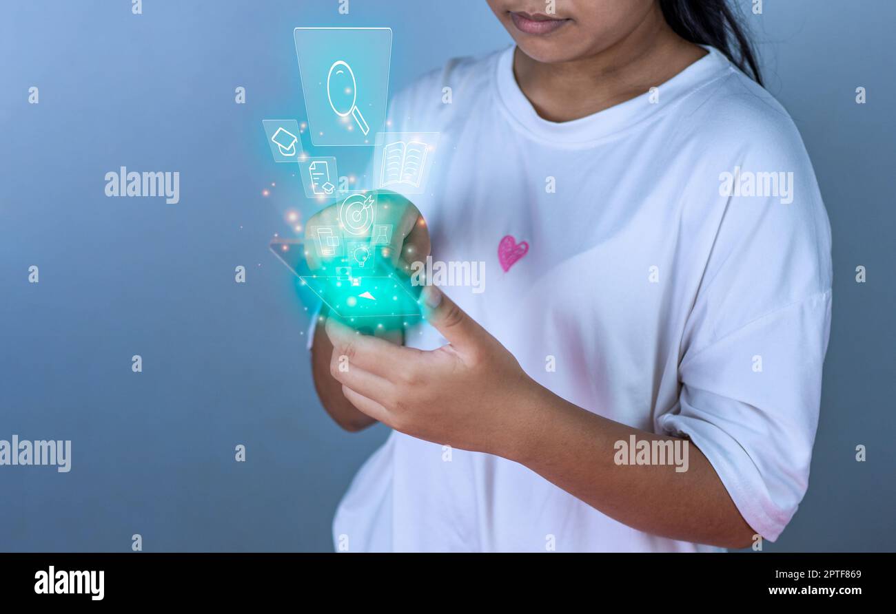 Educational concept picture. A girl stands holding an education icon ...