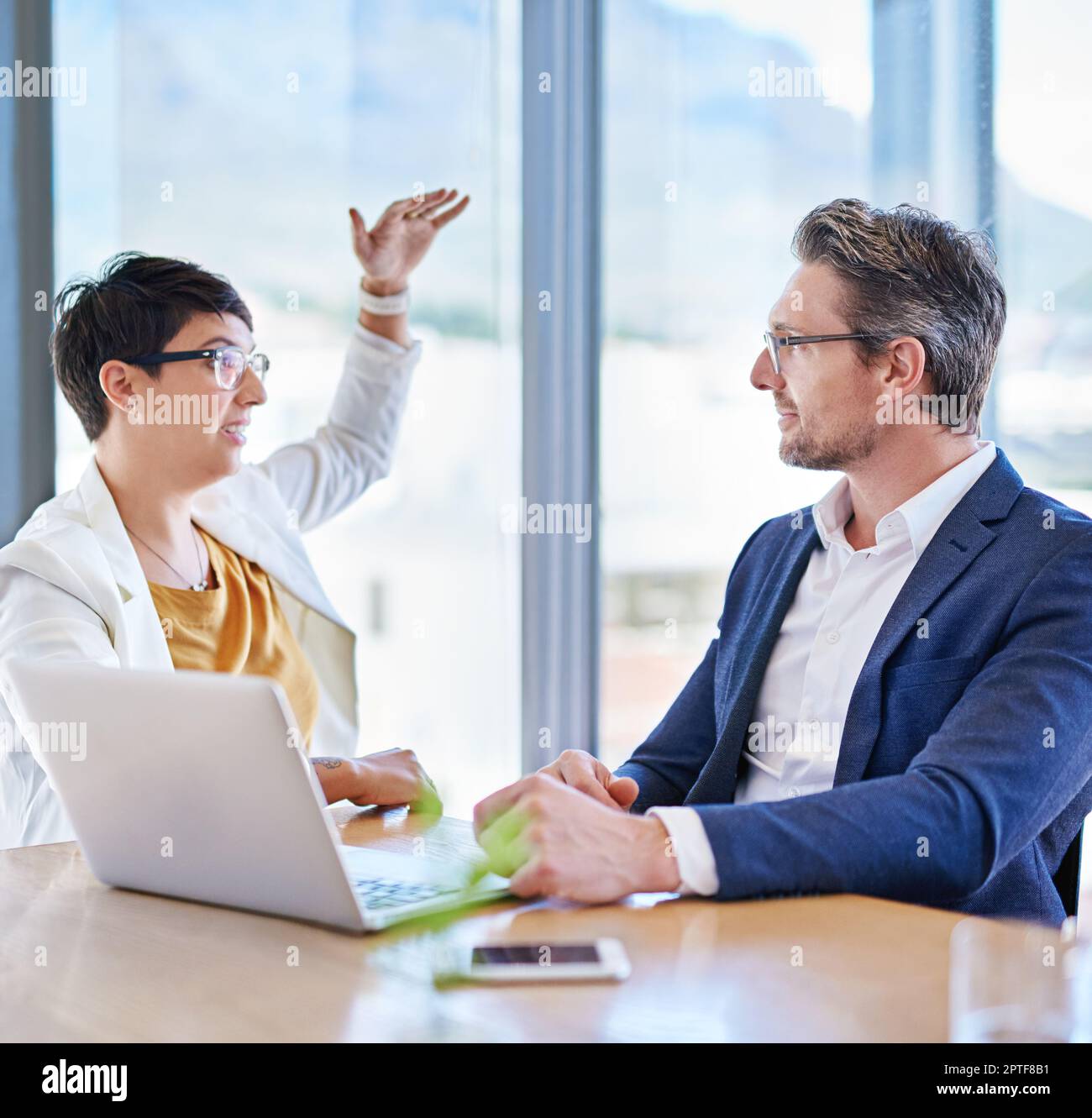 Two men working together on a project hi-res stock photography and ...