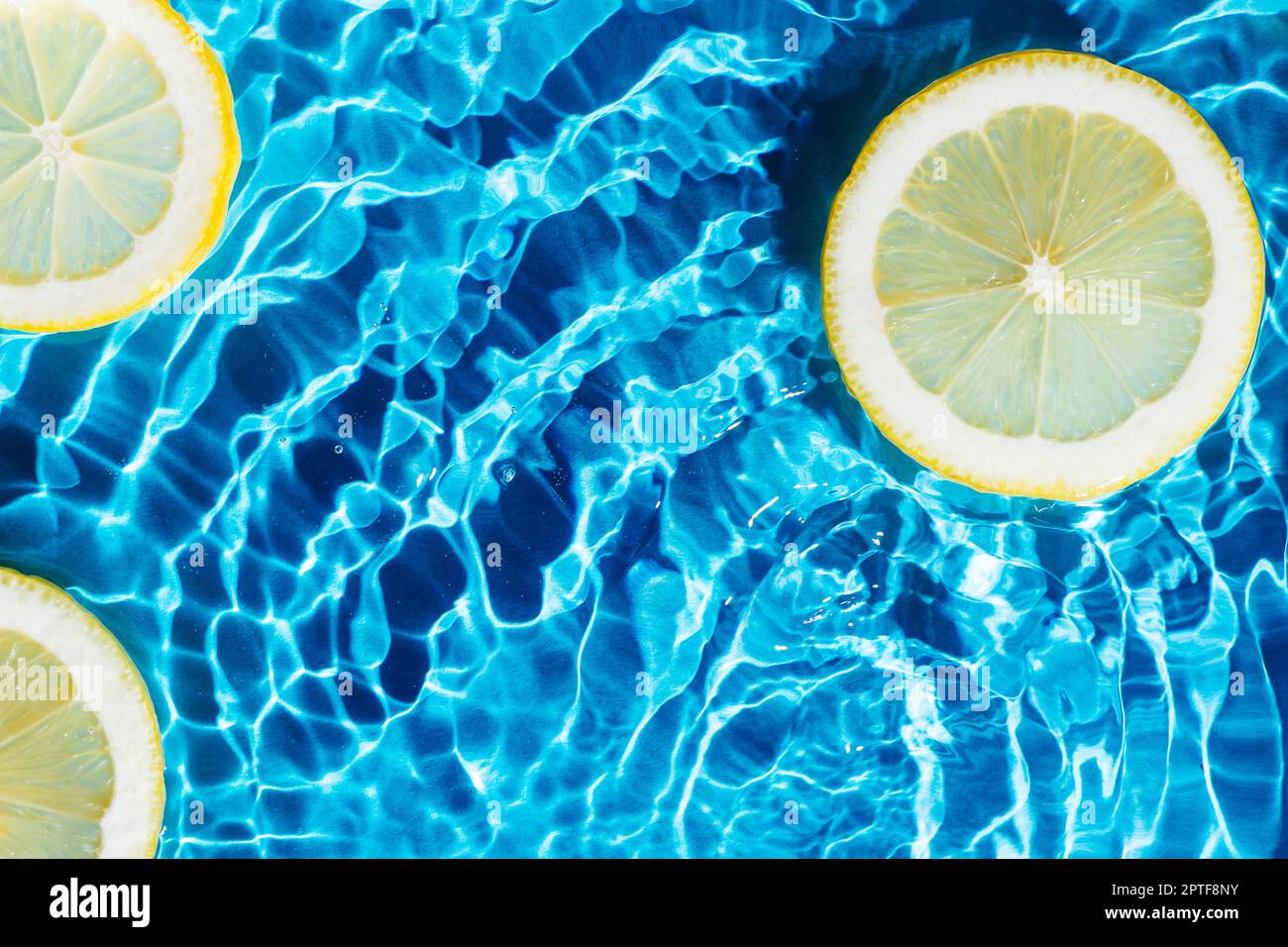 Transparent fresh exhilarant wave water with flecks background, lemon ...