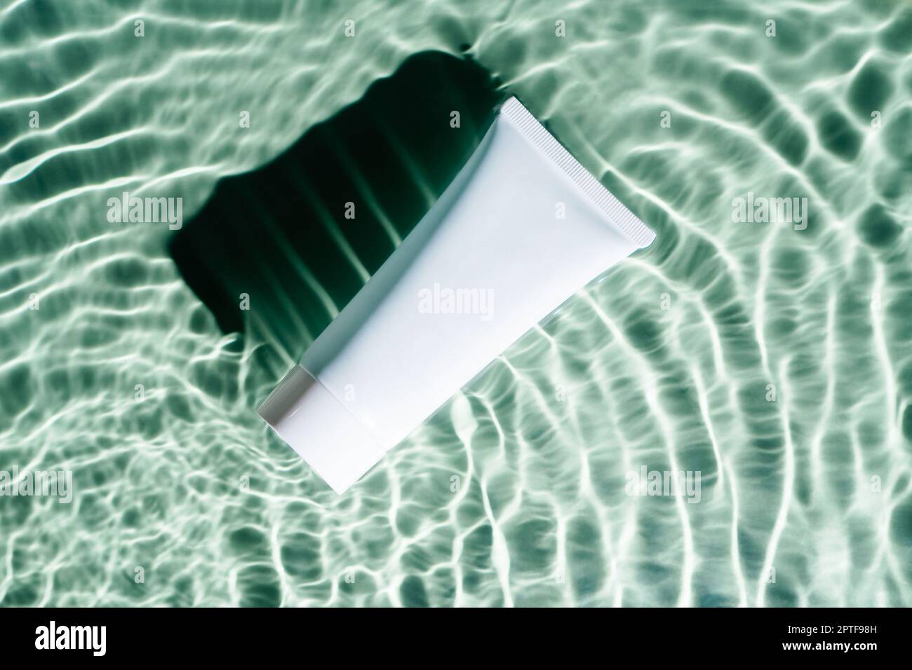 White beauty product sunscreen cream vial tube bottle in transparent ...