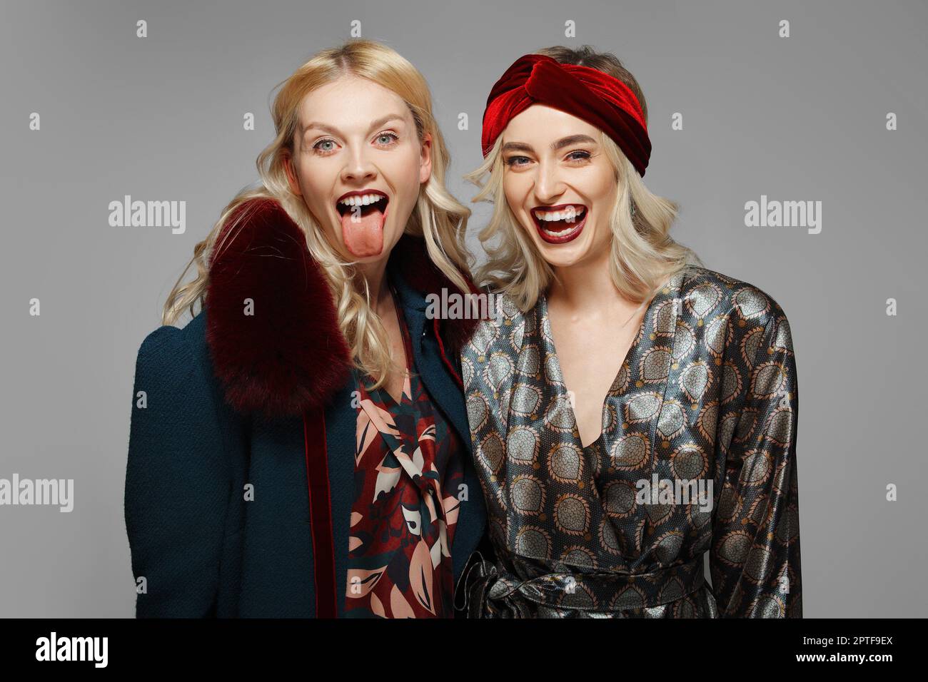 Two happy girls emotionally twitching. Expressing the emotions., Two ...