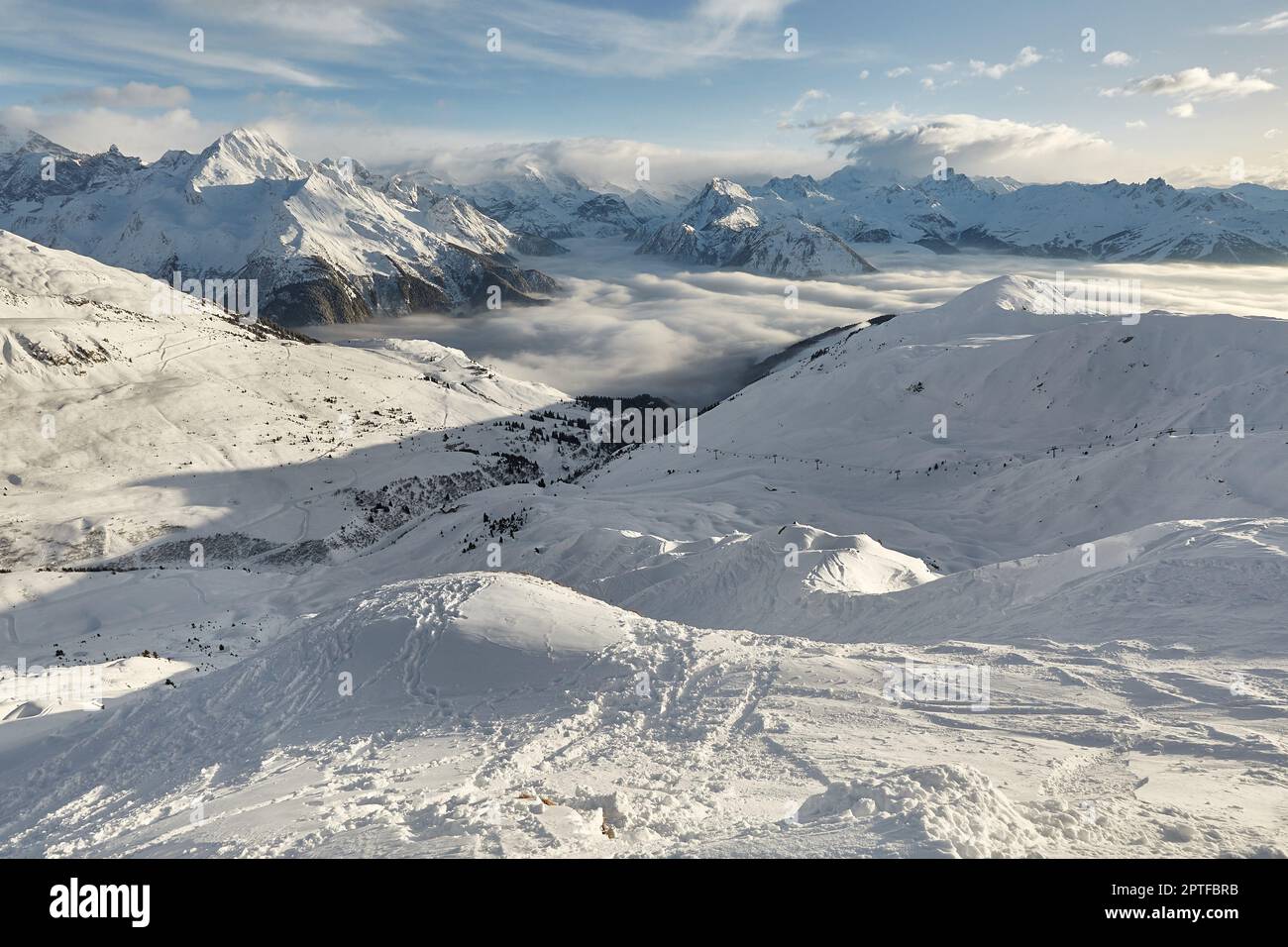 Snowy mountains scenic landscape above clouds below in the valley, big ...