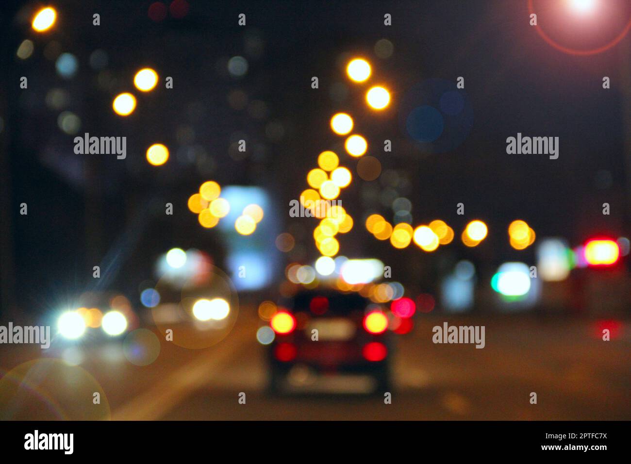 Automobiles with headlights and lights on in night city. Cars with ...