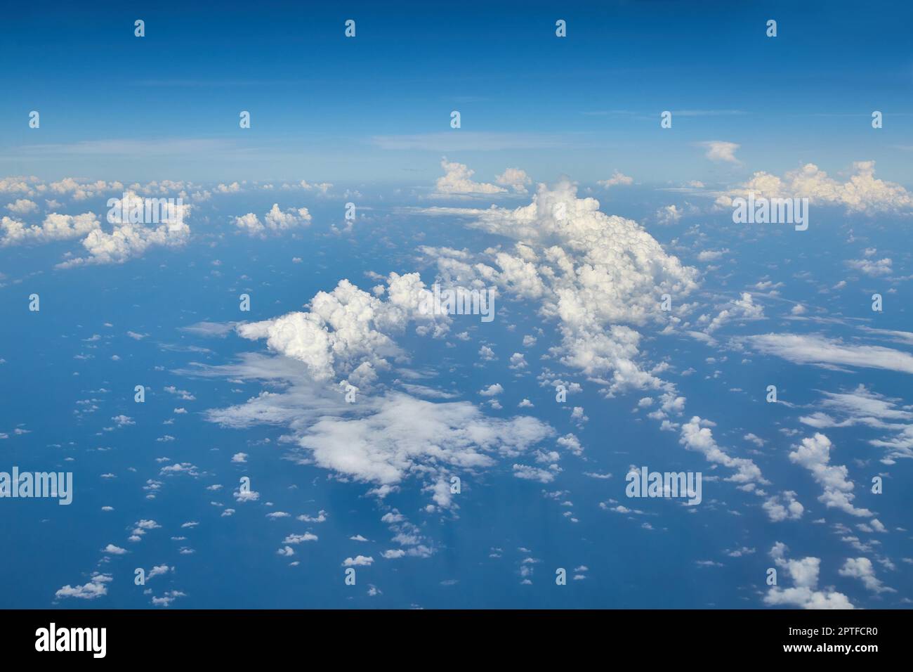 Flying above clouds, and the endless see water of ocean. Crossing the ...
