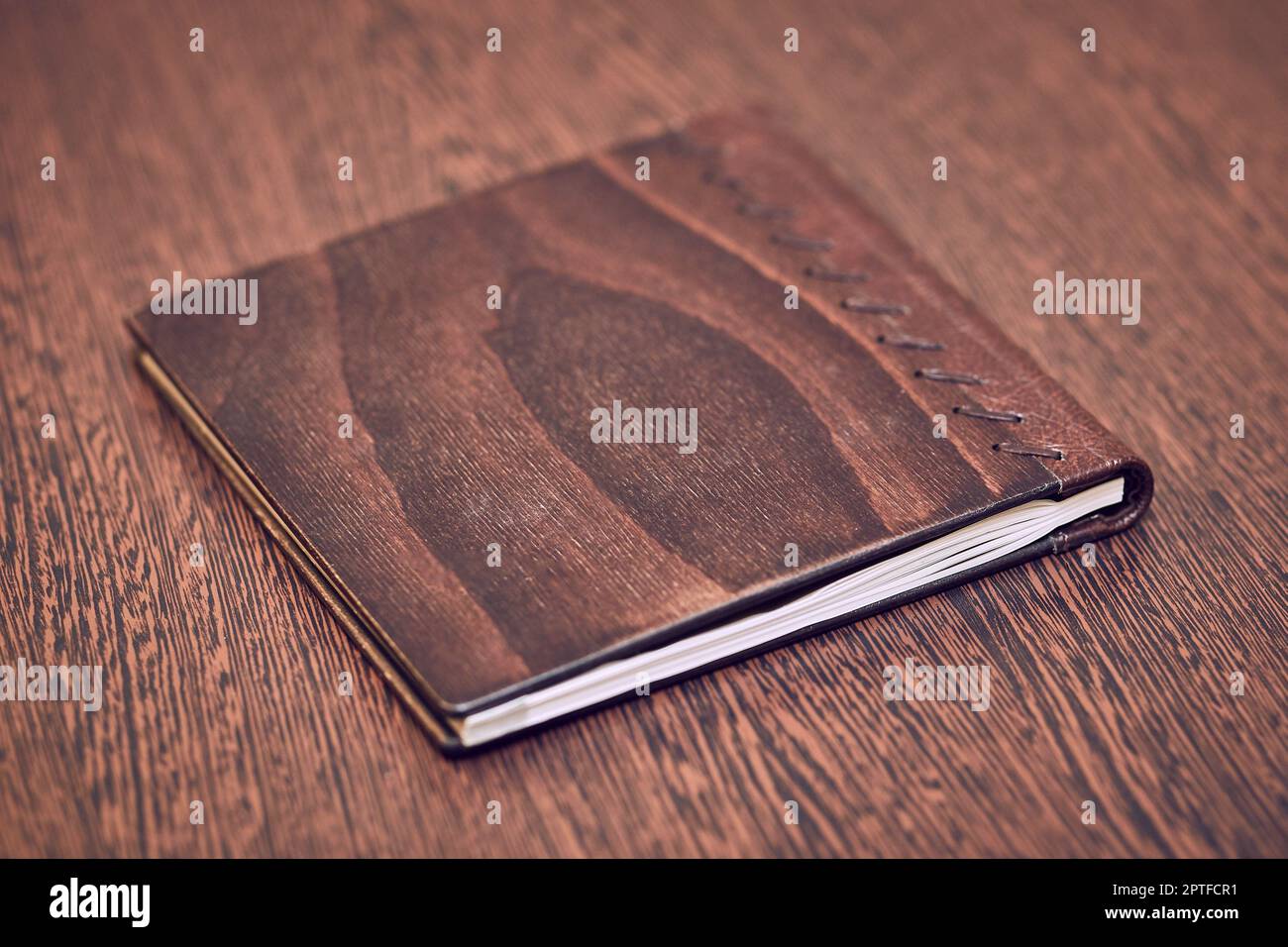 Note book with hard wooden cover Stock Photo - Alamy
