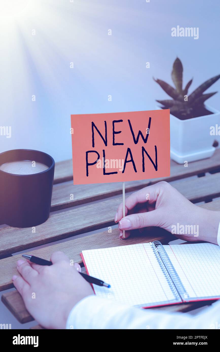 Hand writing sign New Plan, Business overview Start of a detailed ...