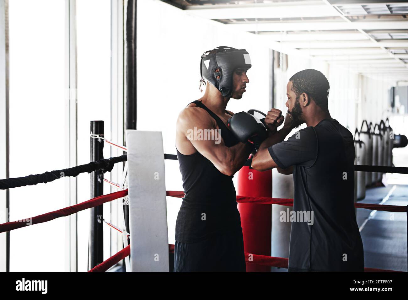 Two of the greatest in one ring. a man training in the boxing ring with ...