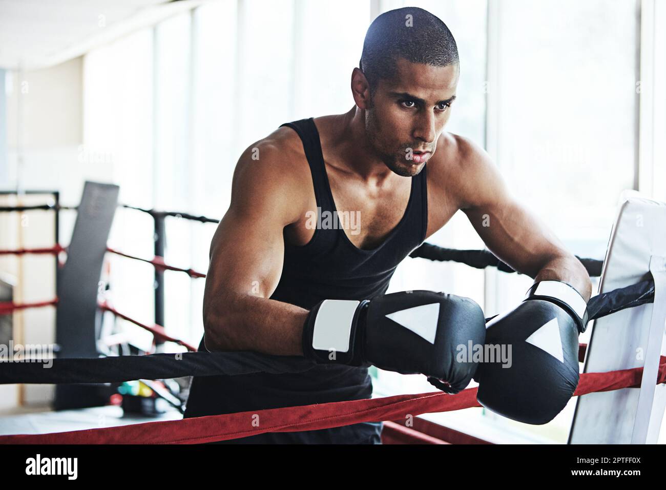Boxing - a sport for the body and the mind. a young man training in a ...
