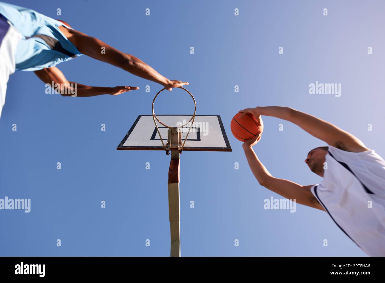 Equal opponents. Two basketball players playing a friendly game Stock ...