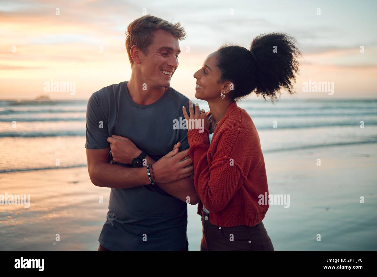 Summer, love and couple at a beach on vacation, bonding and laughing ...