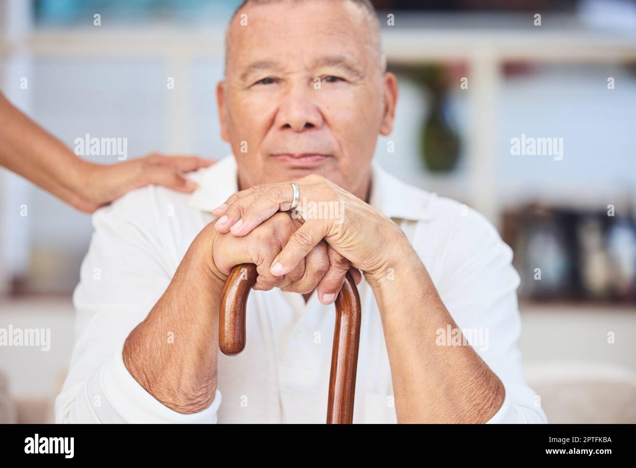 Portrait of elderly man with walking stick, serious and sitting ...