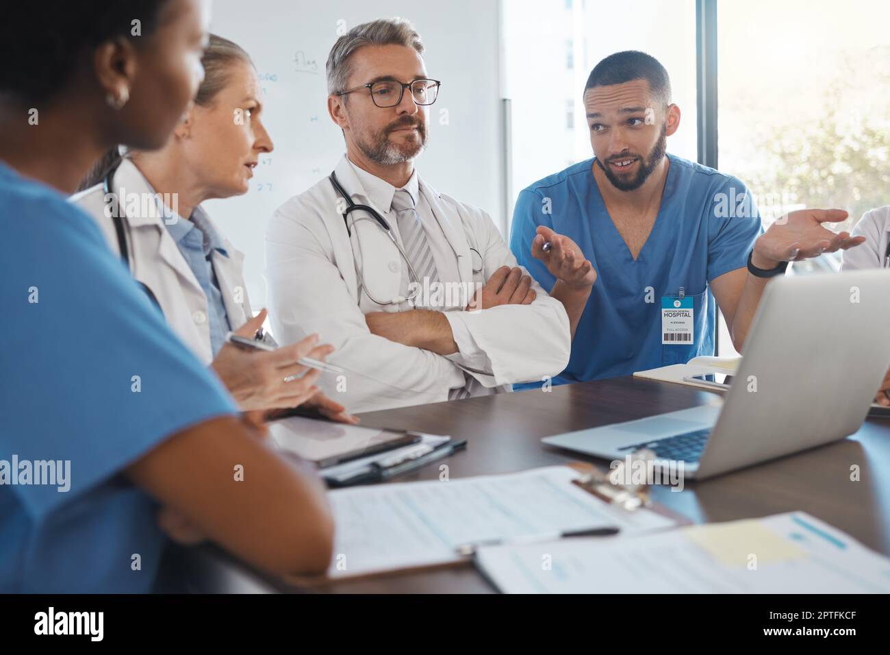 Leadership, doctor and teamwork planning on laptop in conversation ...