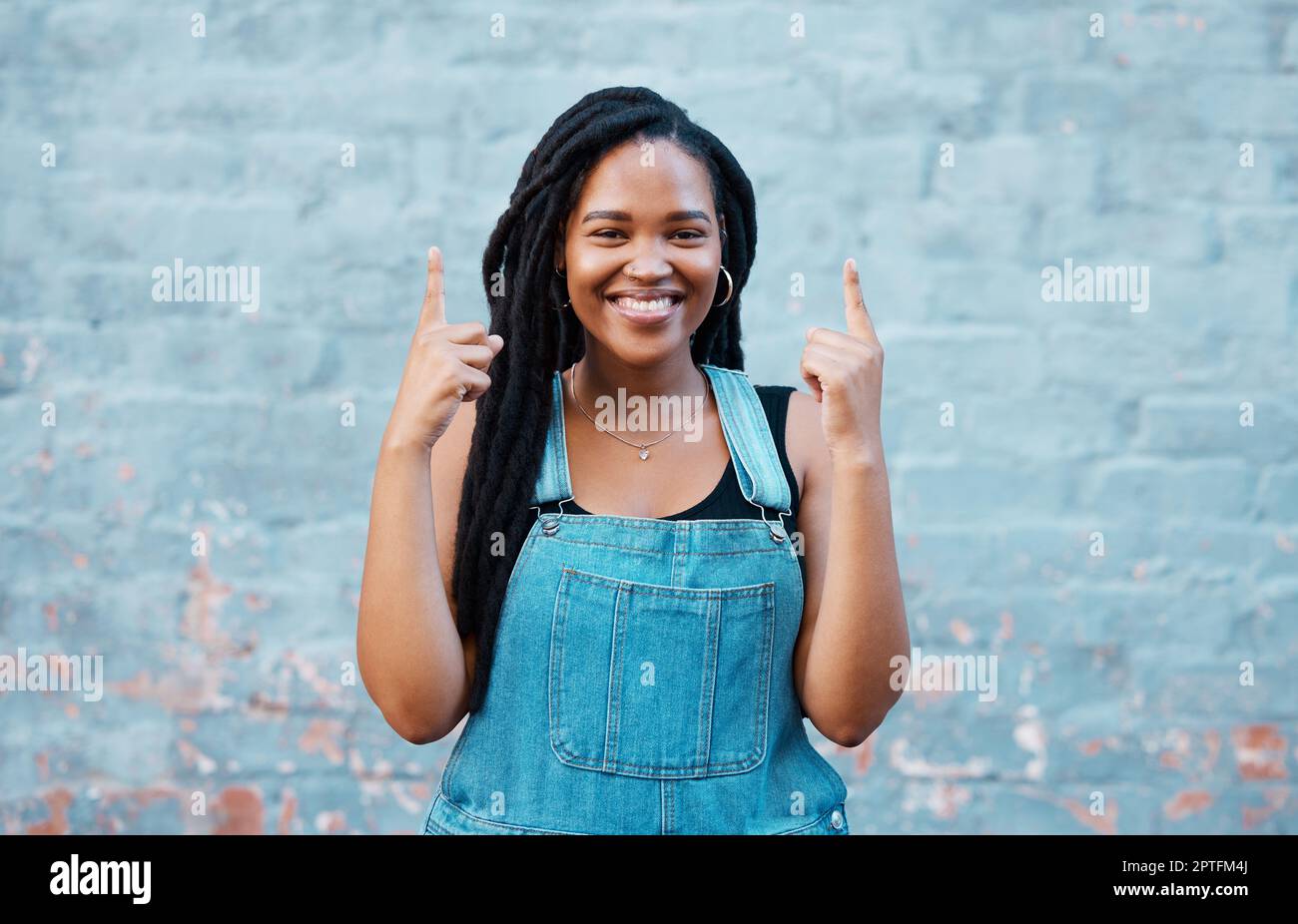 Mockup portrait of happy black woman pointing for marketing, advertising or news announcement ...