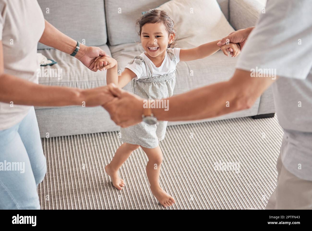 Happy family, child and playing circle game while bonding, fun and holding hands with energy ...